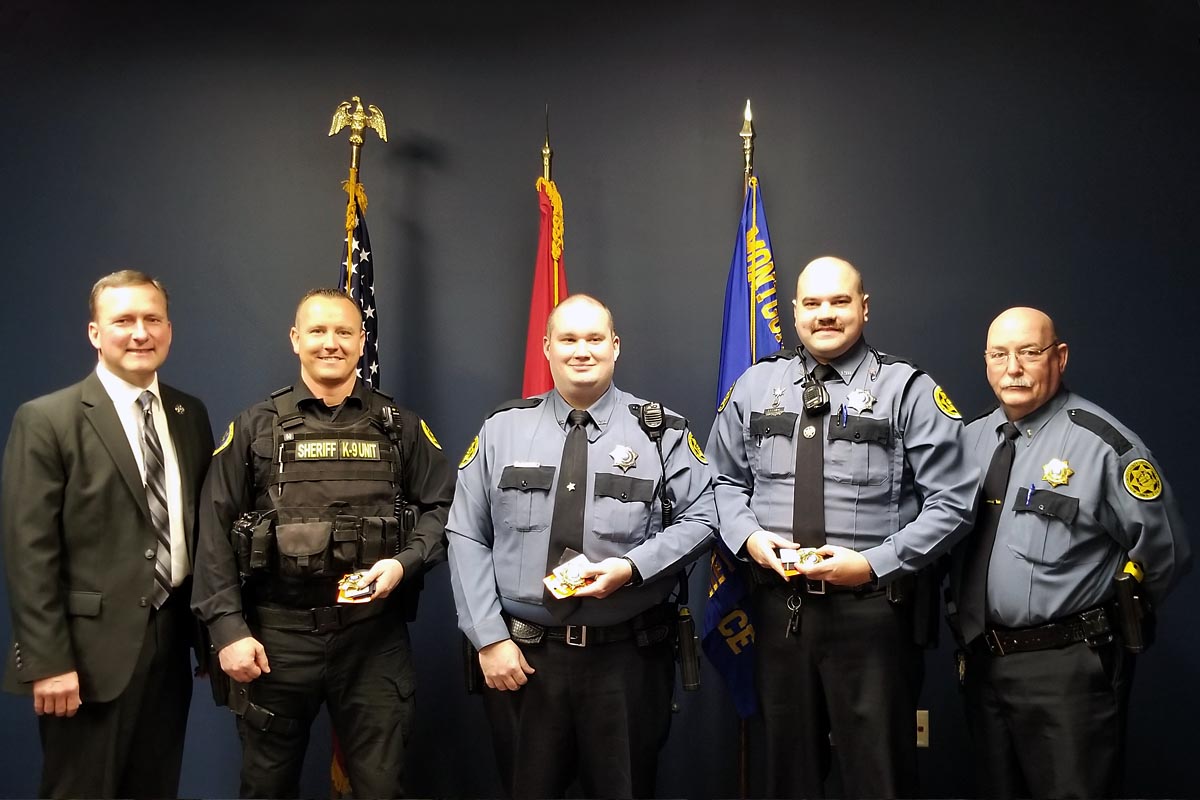 Montgomery County Sheriff John Fuson congratulates Eric Trout, Matthew ...