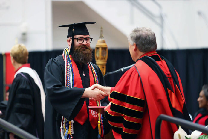 Austin Peay State University graduate student Brandon Morris receives ...